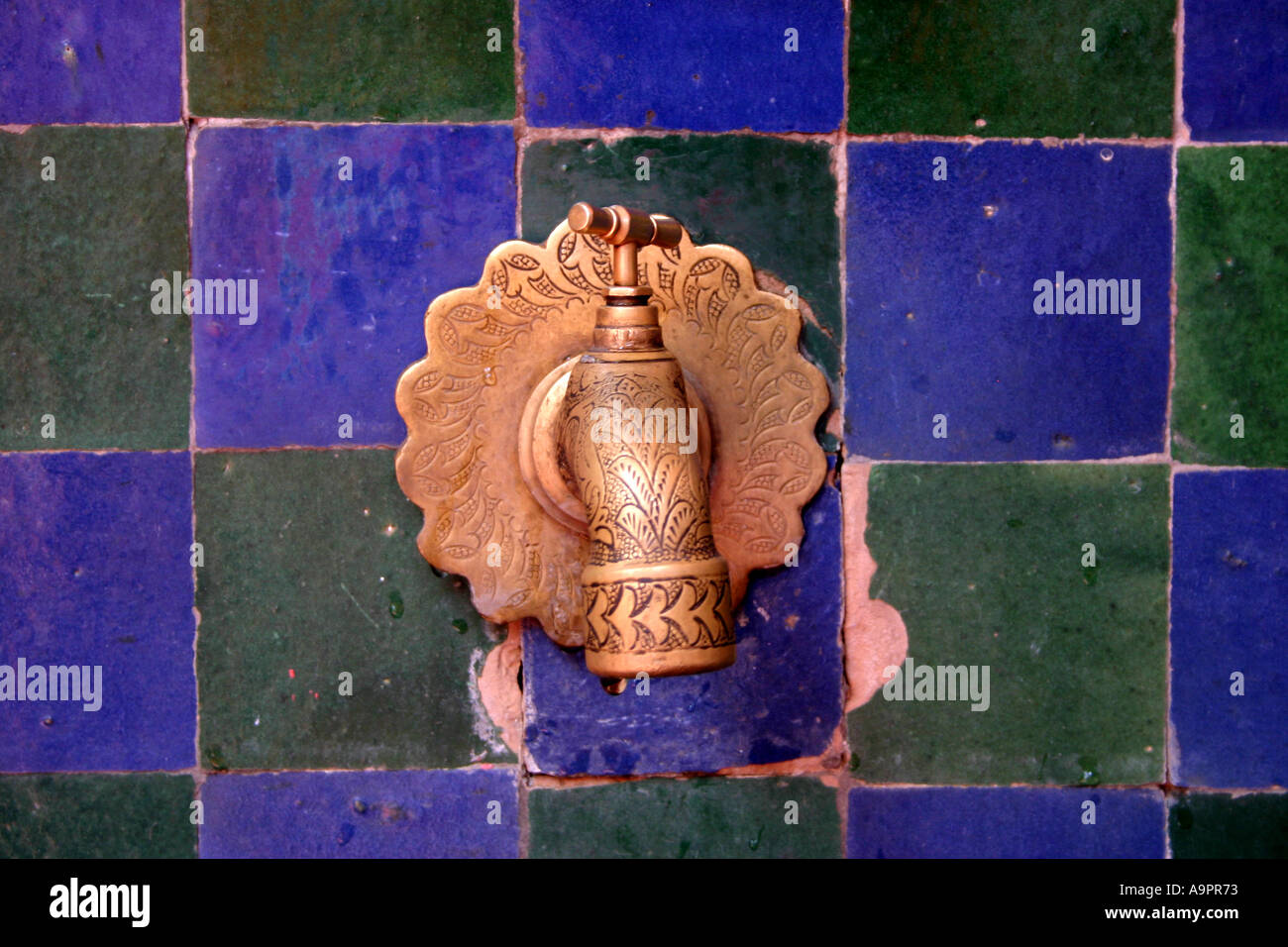 Decorative Brass Tap set in blue and green tiles Majorelle Gardens ...