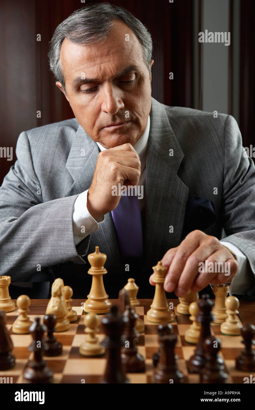 Ceo playing a game of chess Stock Photo - Alamy