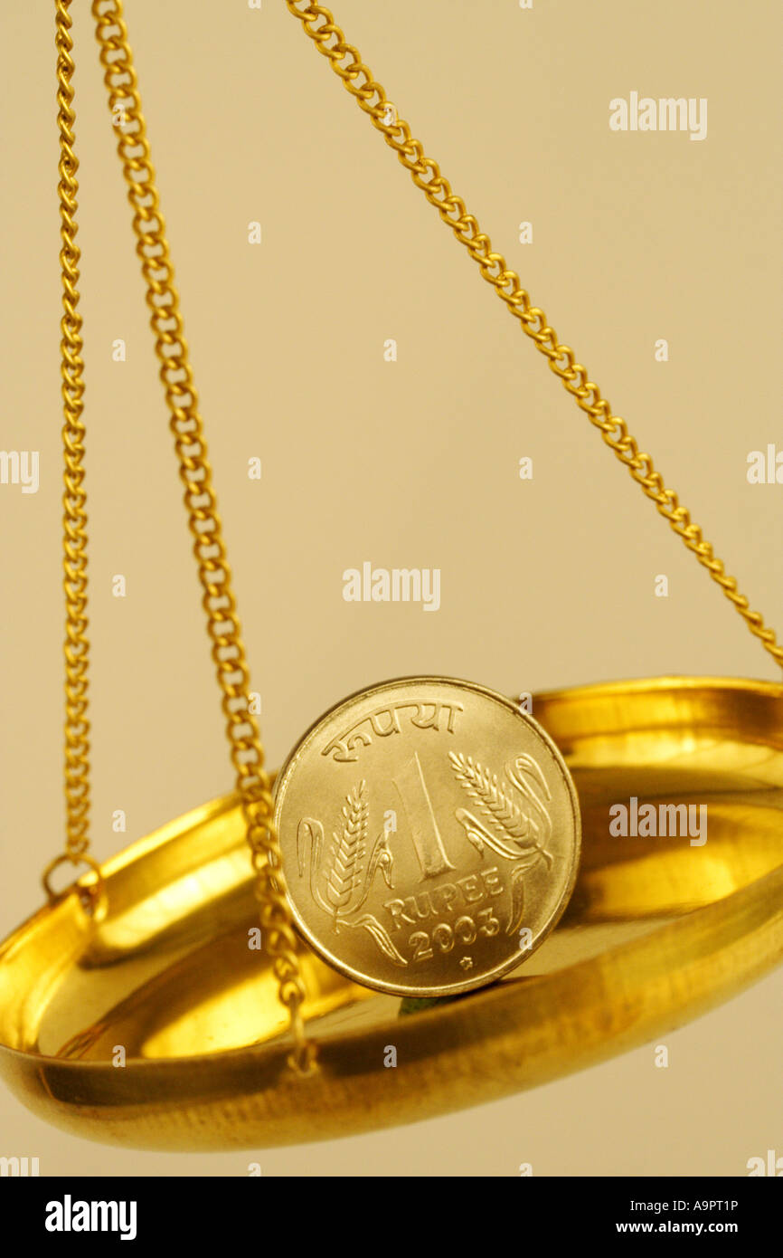 A balance with money Stock Photo - Alamy