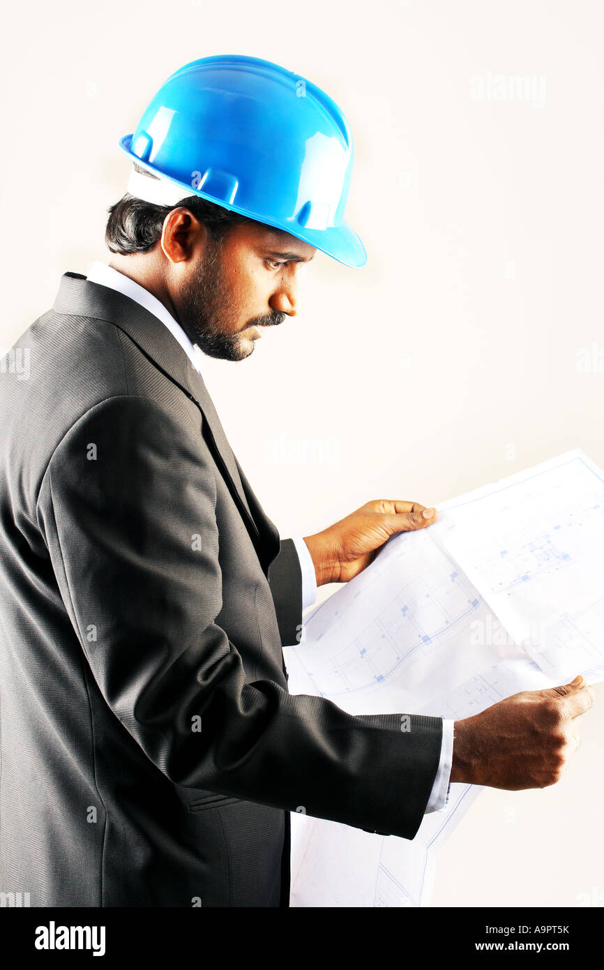 Portrait of an engineer with a blueprint Stock Photo - Alamy