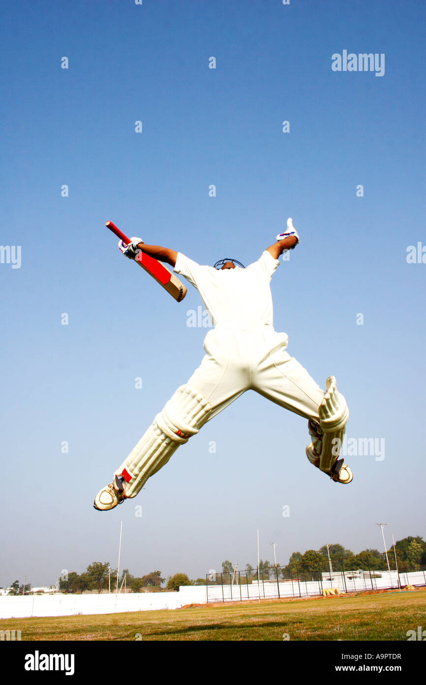Cricket batsman raising bat hi-res stock photography and images - Alamy