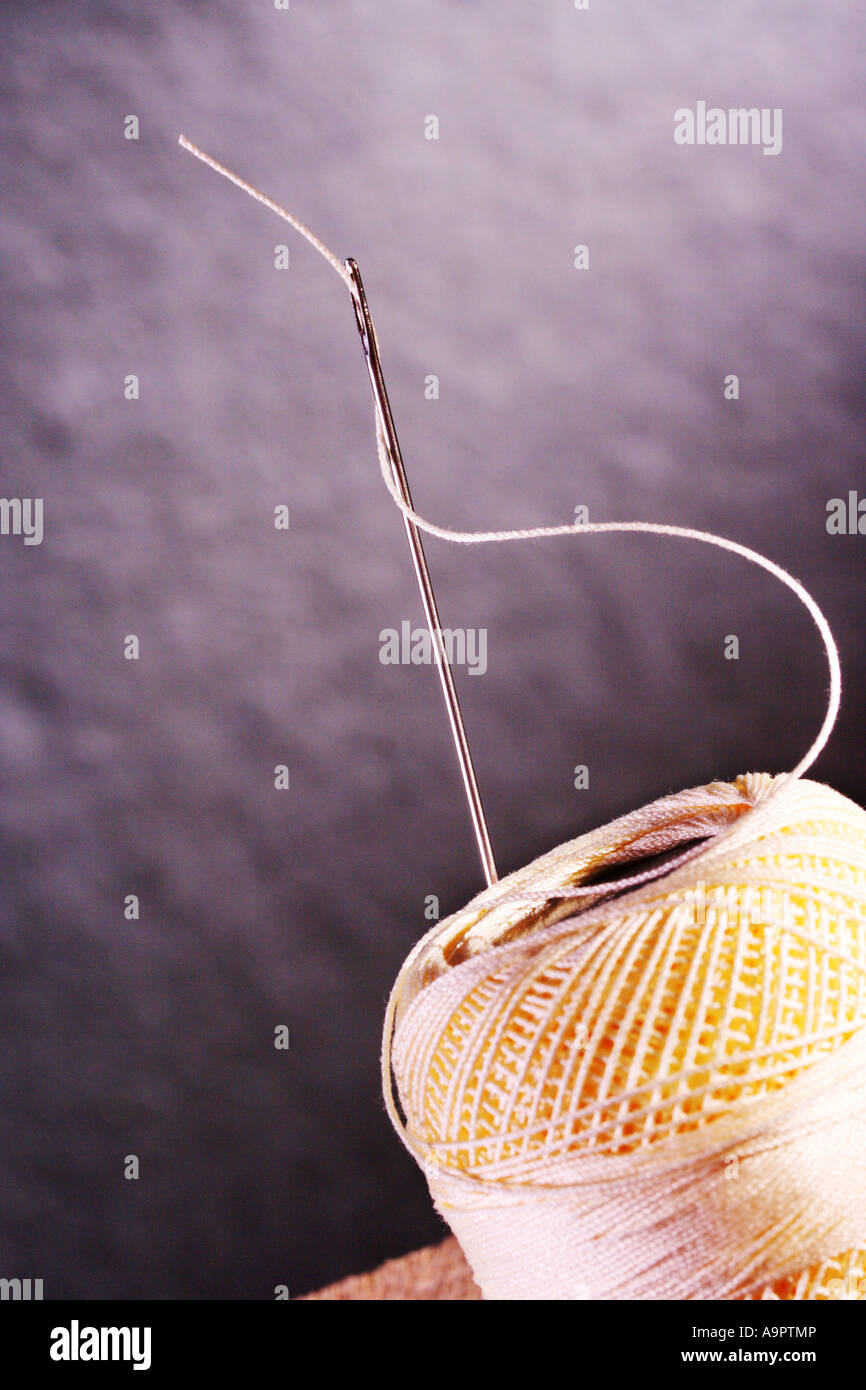 A spool and needle Stock Photo - Alamy