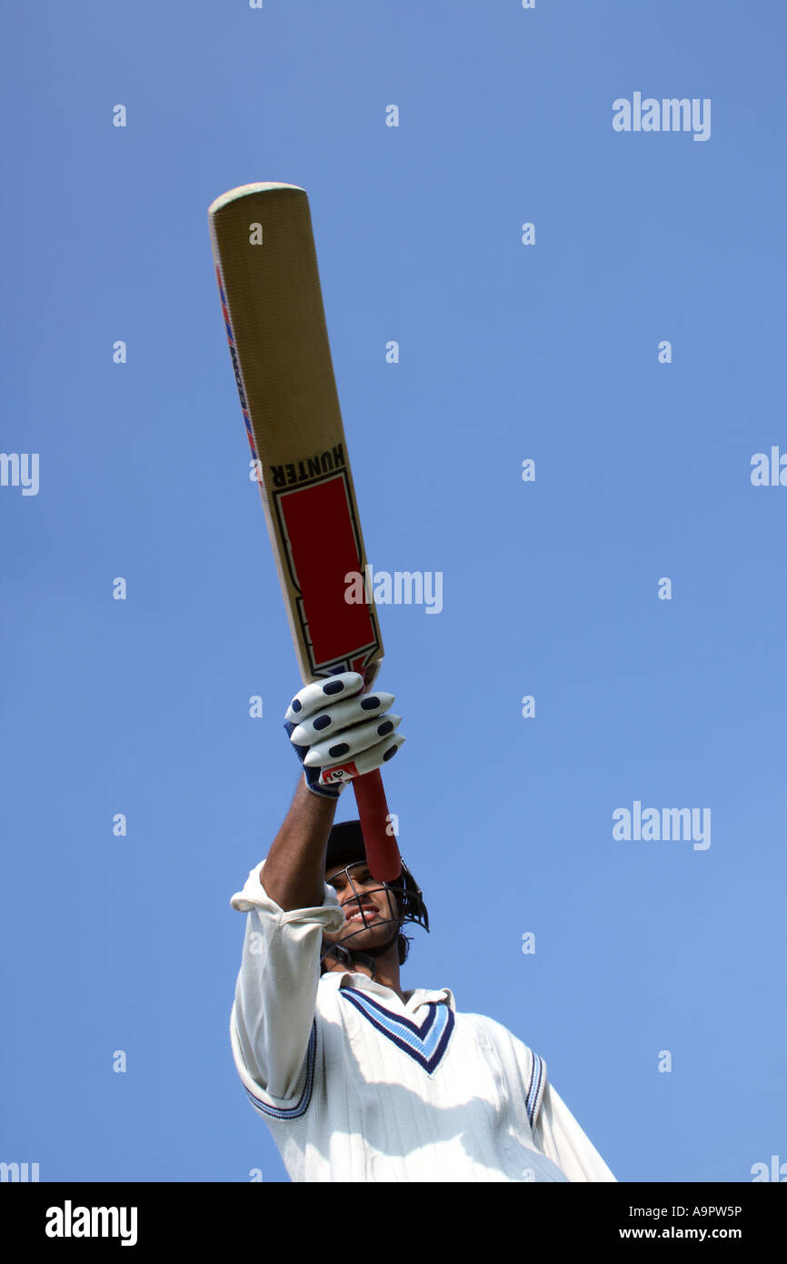 Cricket batsman raising bat hi-res stock photography and images - Alamy