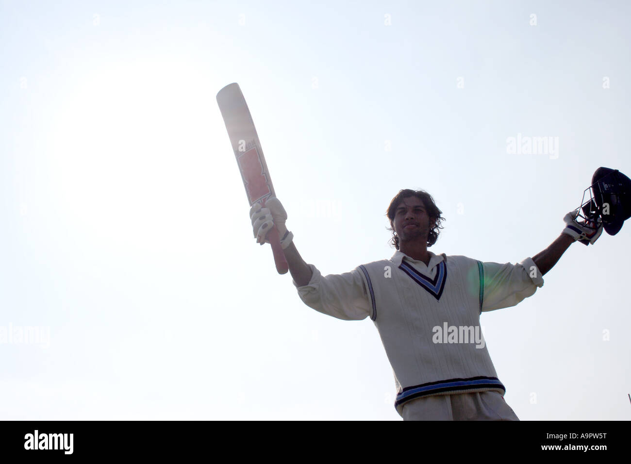 Cricket batsman raising bat hi-res stock photography and images - Alamy