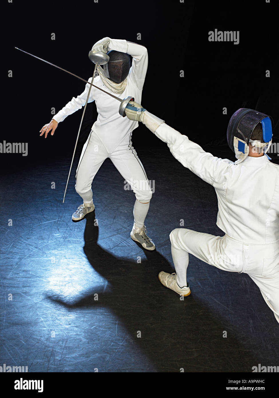 Female fencer holding fencing foil hi-res stock photography and images - Alamy