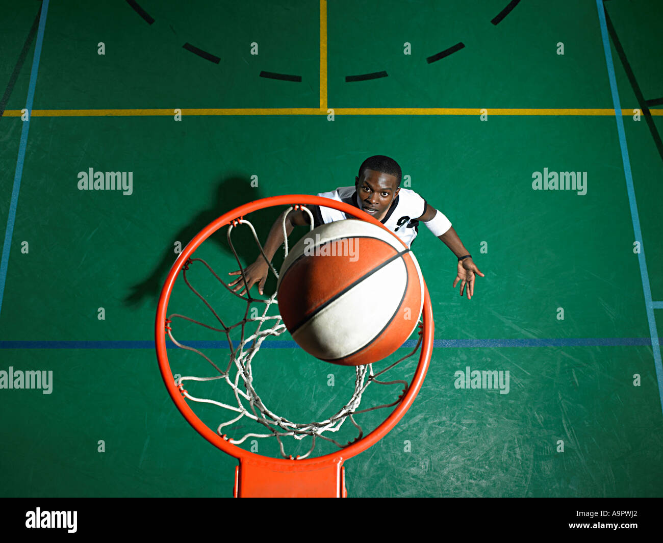 Basketball player scoring Stock Photo - Alamy