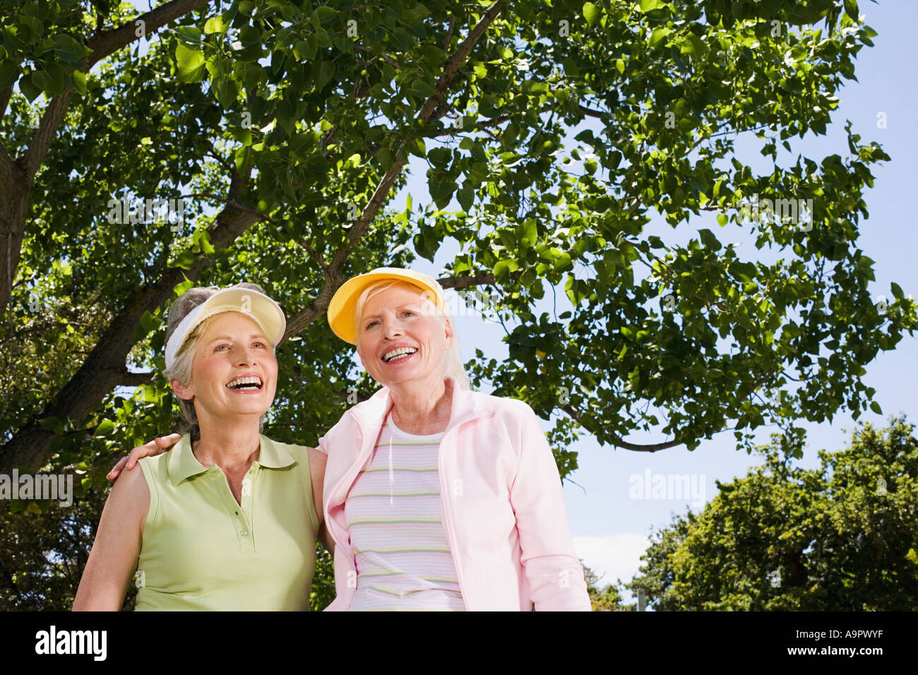 Two senior adult women in park Stock Photo - Alamy