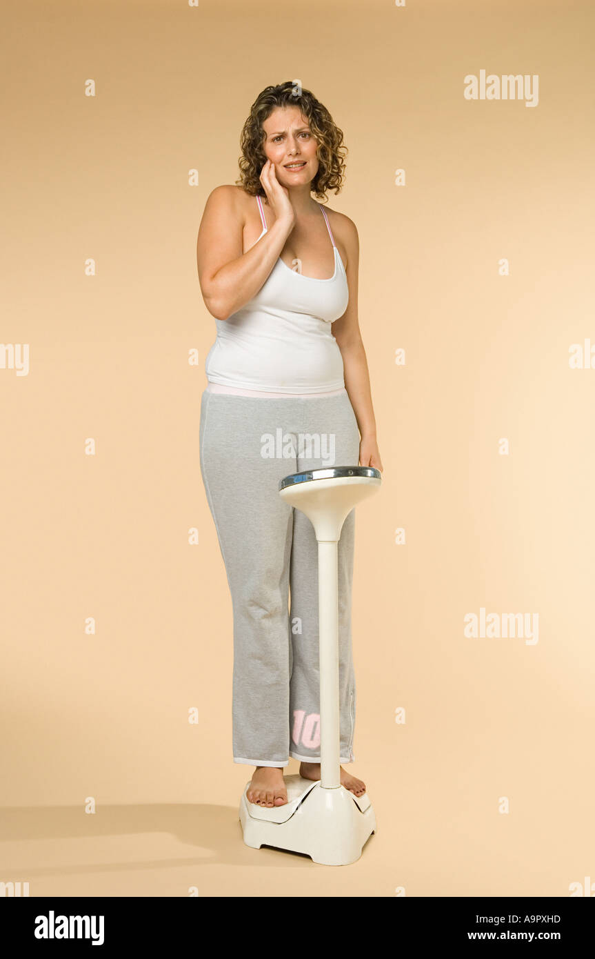 Overweight woman scales hi-res stock photography and images - Alamy