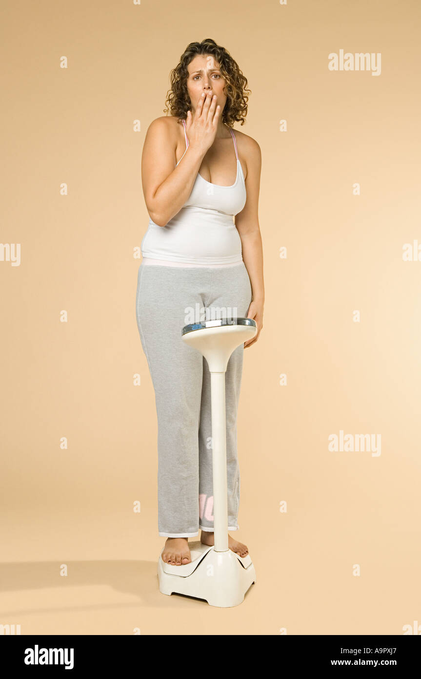 Overweight woman scales hi-res stock photography and images - Alamy