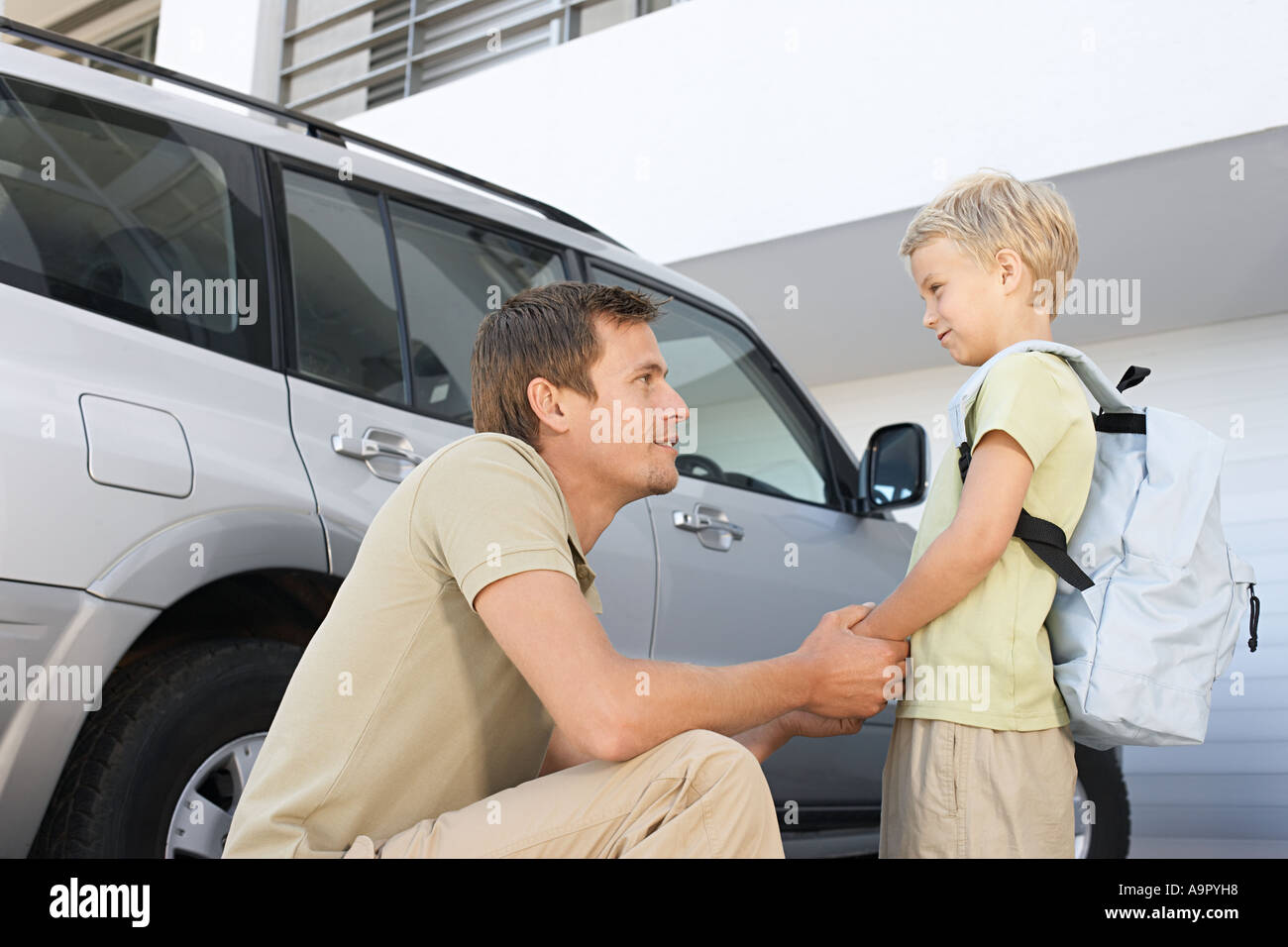 Father comforting his crying son Stock Photo - Alamy
