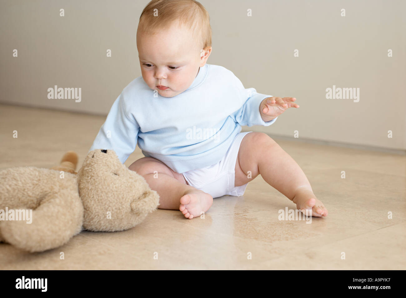 Baby reaching for object hi-res stock photography and images - Alamy