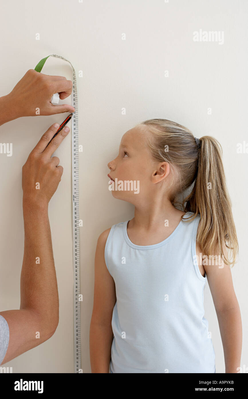 Measuring a childs height Stock Photo - Alamy
