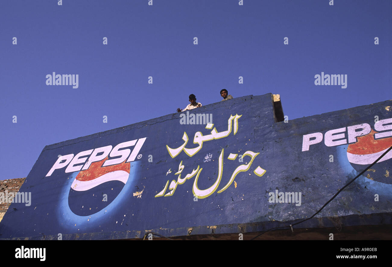 The global brand of Pepsi painted on a building in the urban slum of ...