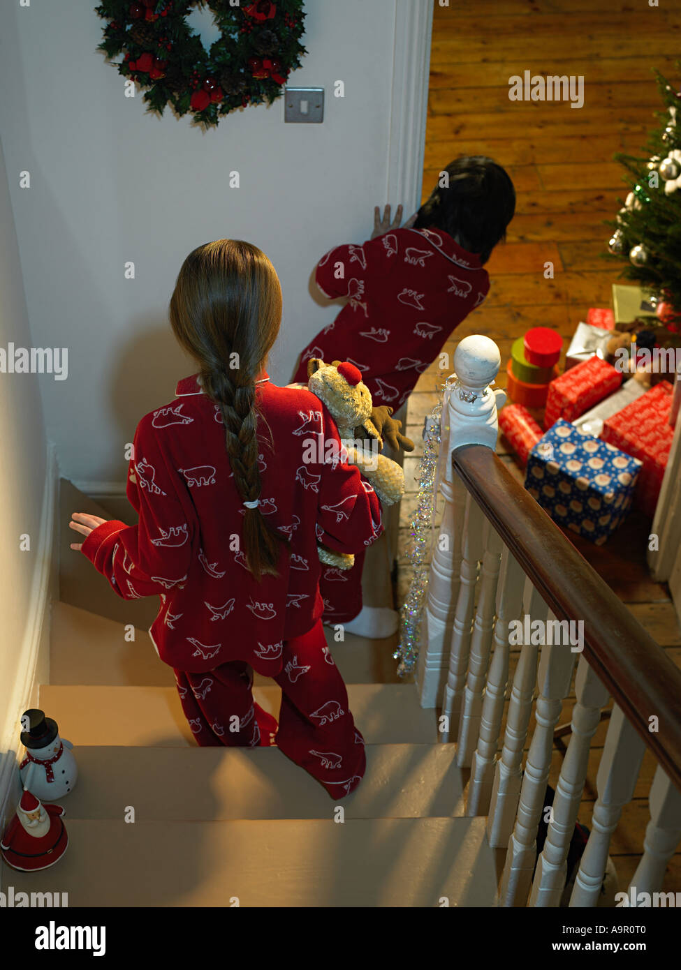 Children walking downstairs on christmas eve Stock Photo - Alamy