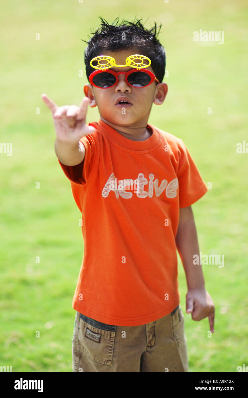 A young kid posing with toy goggles Stock Photo - Alamy
