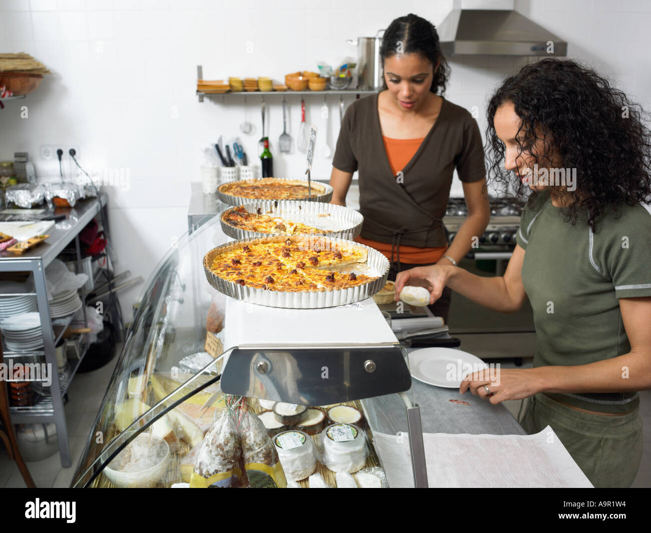Woman cheese kitchen europe hi-res stock photography and images - Alamy