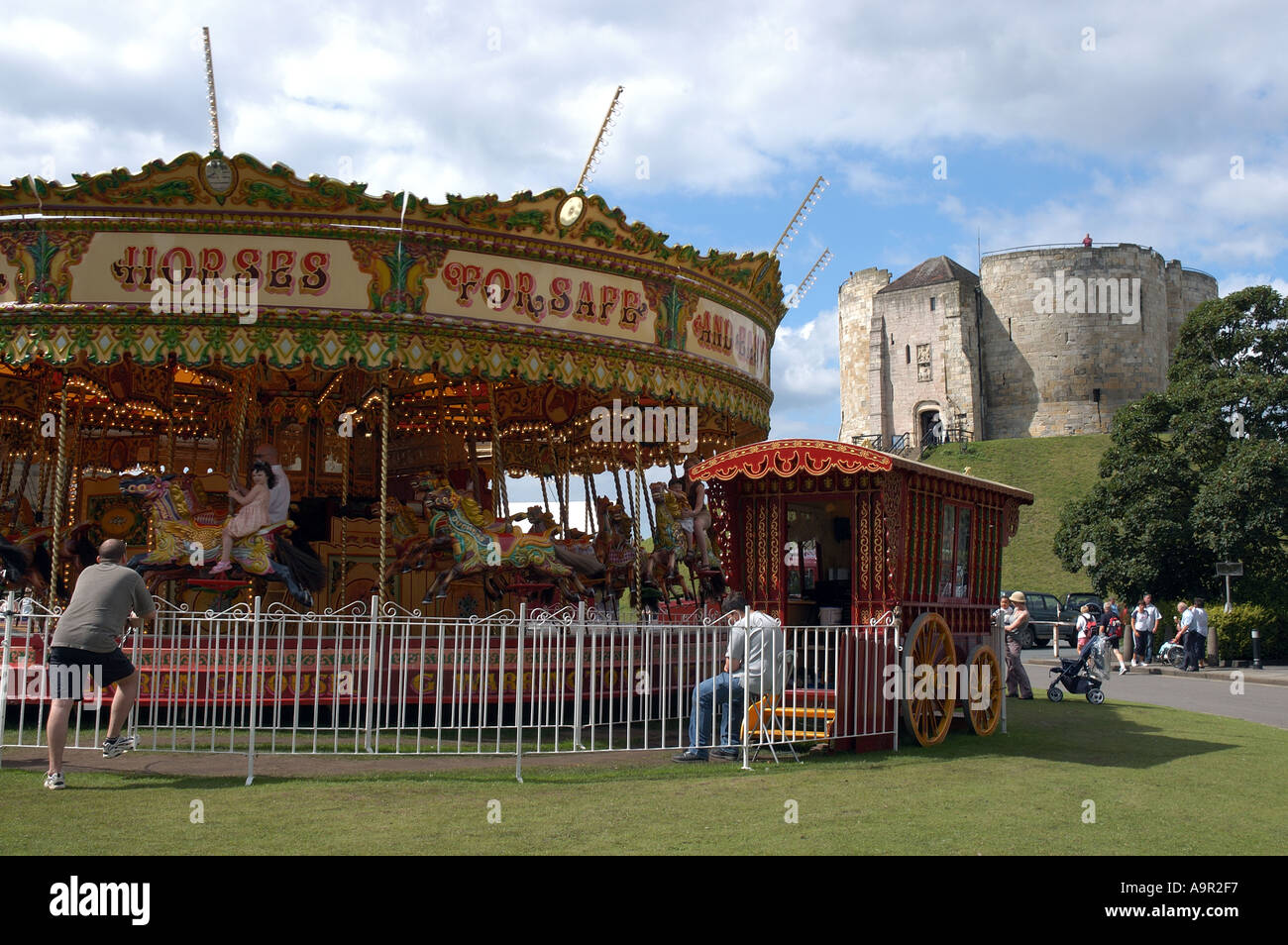 Carousel ride and Cliffords Tower York North Yorkshire England UK ...