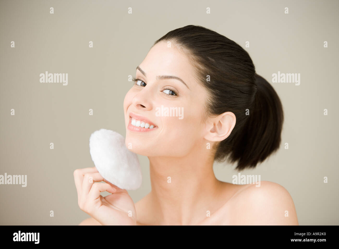 Teenage girl with powder puff Stock Photo - Alamy