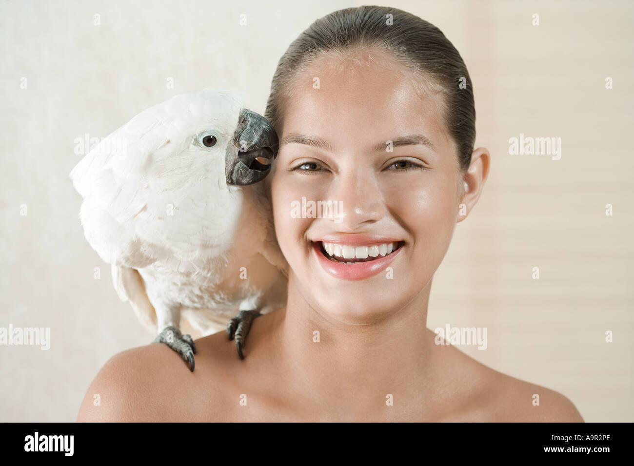 Girl with pet cockatoo Stock Photo - Alamy