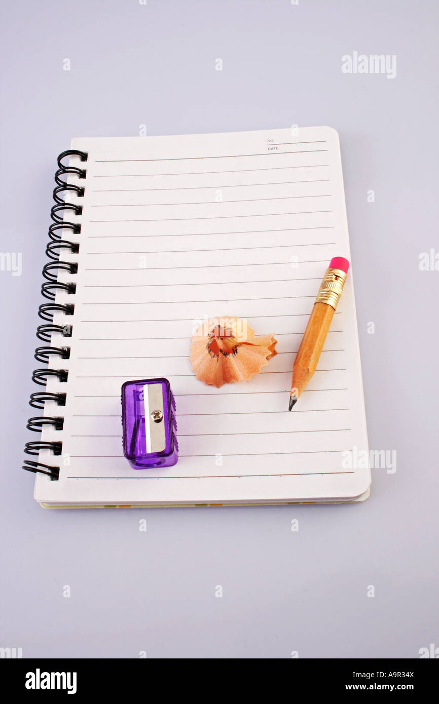 Studio shot of a pencil sharpener and book Stock Photo - Alamy