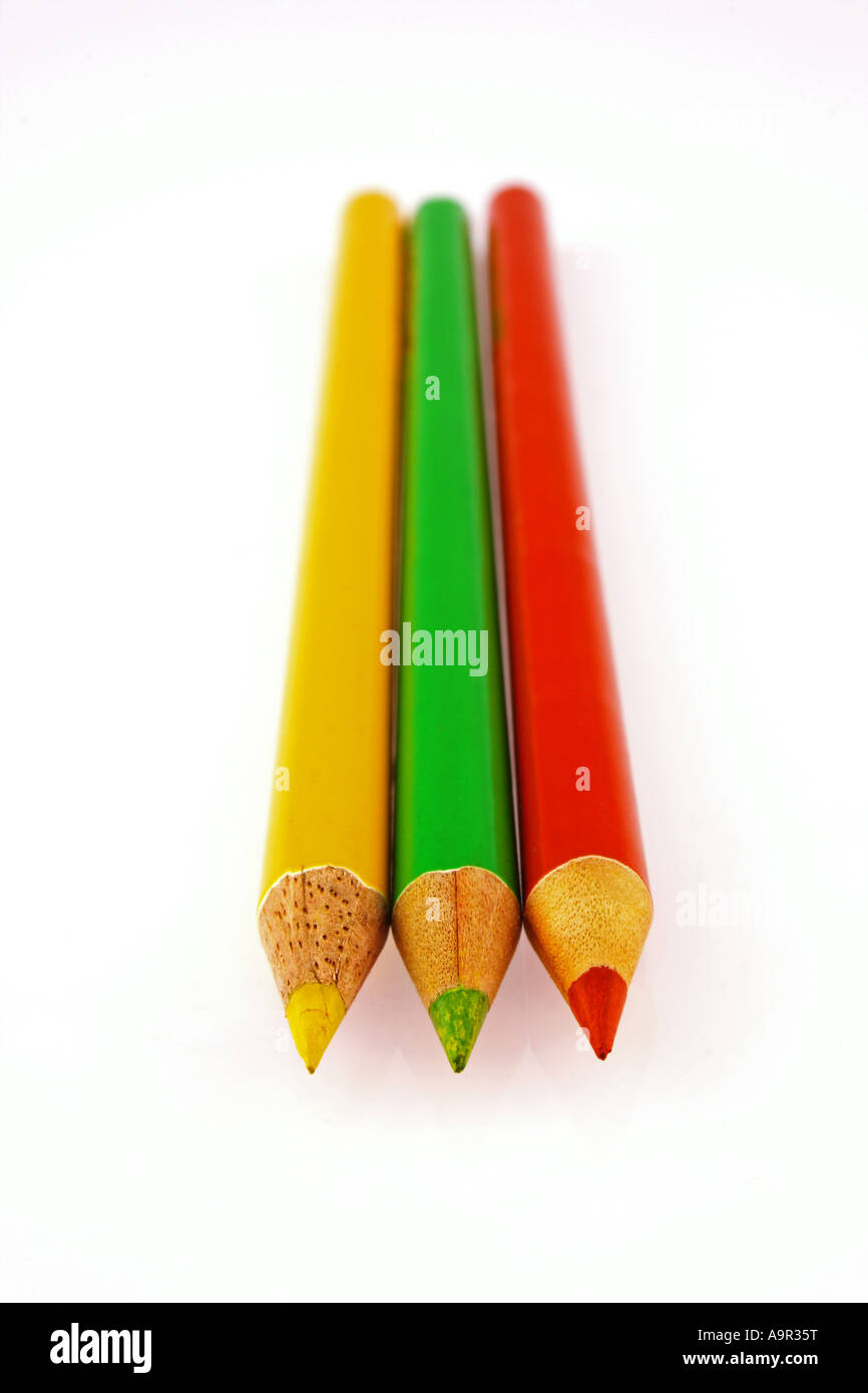 Three colour pencils in a row Stock Photo - Alamy