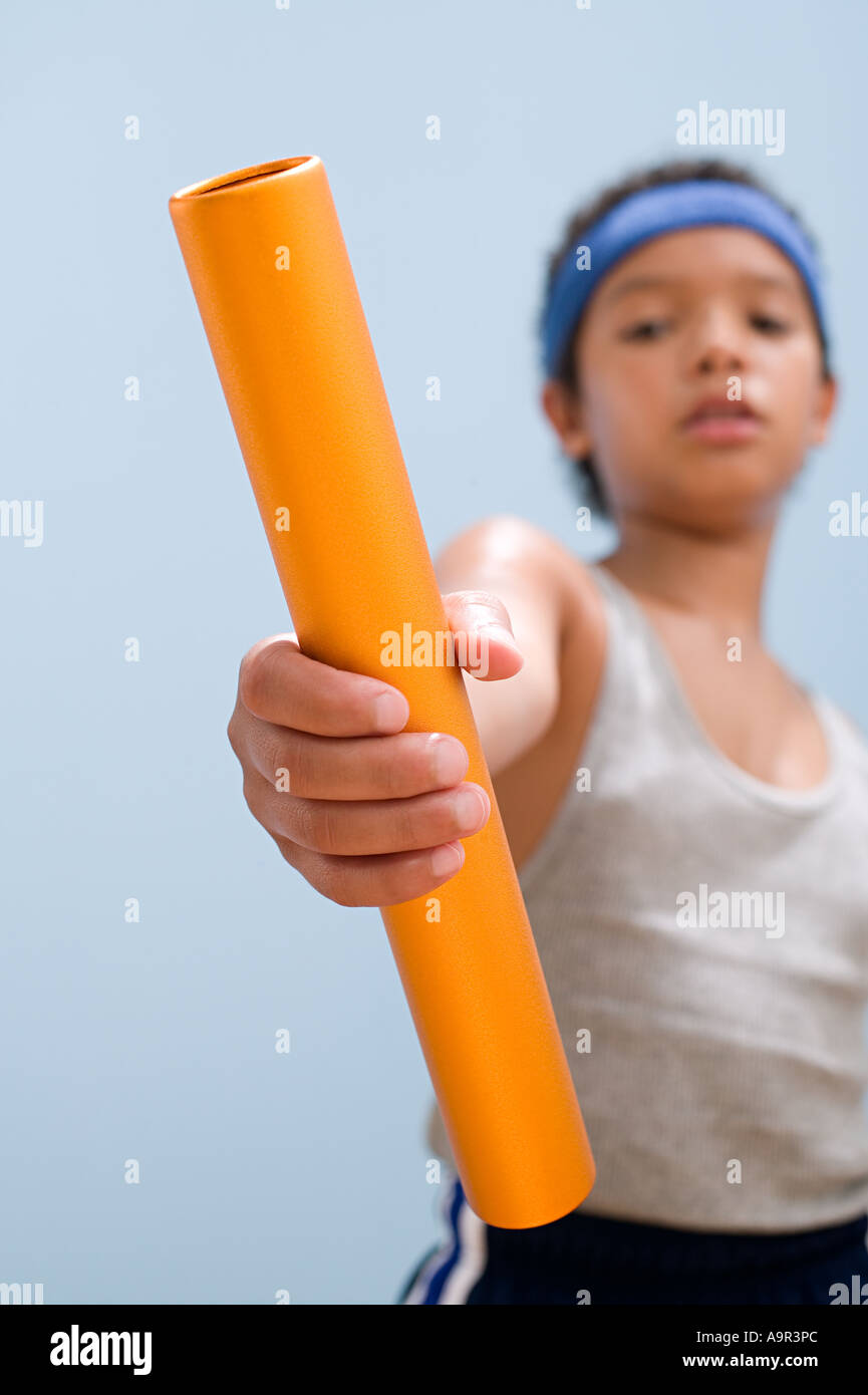 Boy passing relay baton Stock Photo - Alamy
