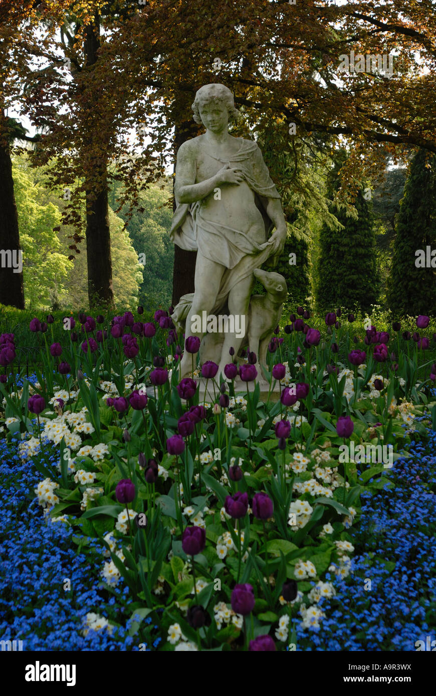 Statue among the flower beds Stock Photo - Alamy