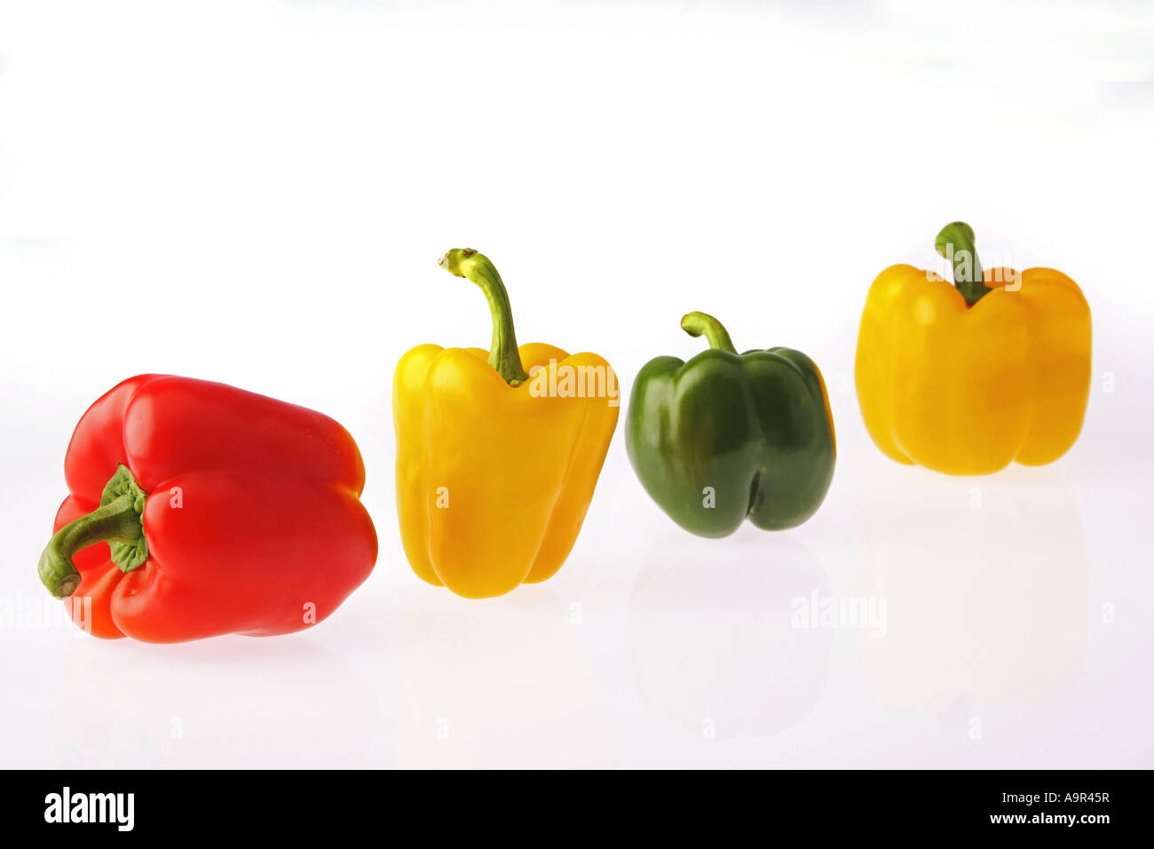 Close up of capsicum in a row Stock Photo - Alamy