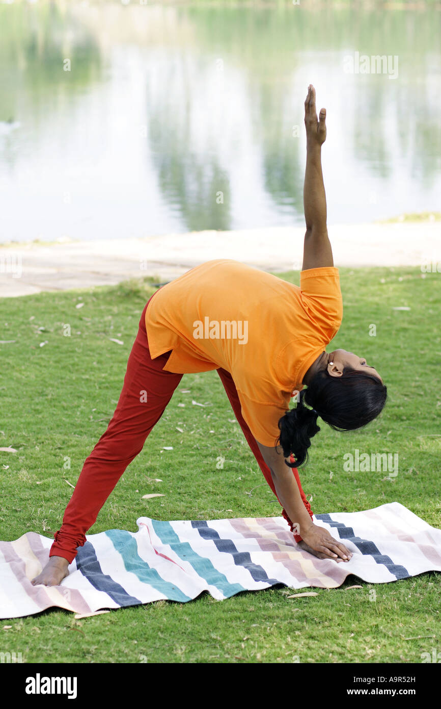 A woman doing yoga exercises Stock Photo - Alamy