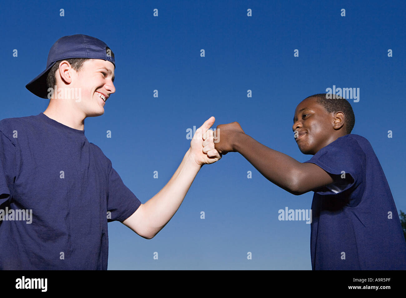 Two teenage boys celebrating Stock Photo - Alamy