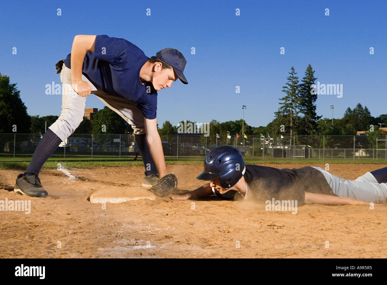 Two teenage boys playing baseball Stock Photo - Alamy