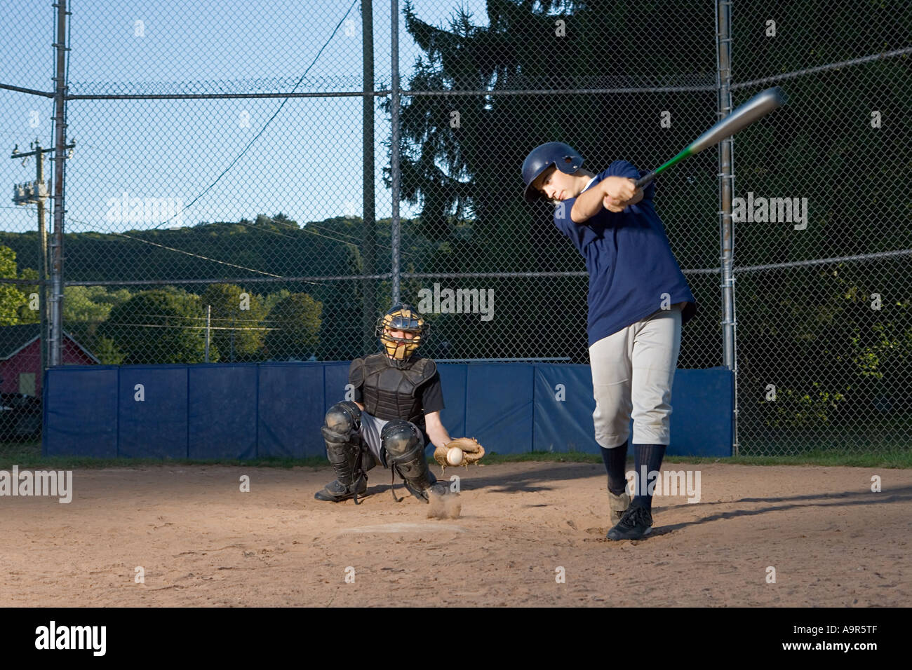Teenage boy missing baseball Stock Photo - Alamy