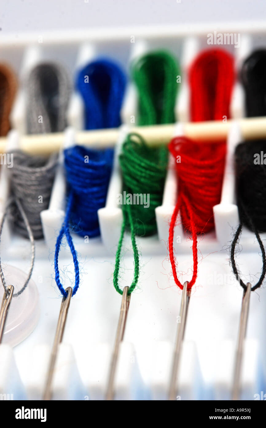 Colourful threads and needles Stock Photo - Alamy