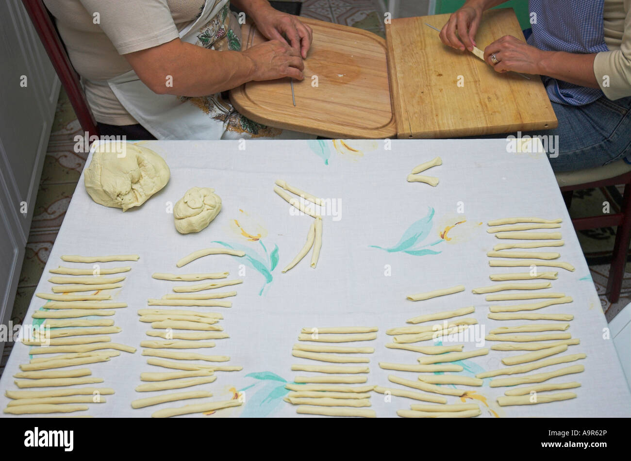 Italian mother and daughter making fresh pasta at home Stock Photo - Alamy