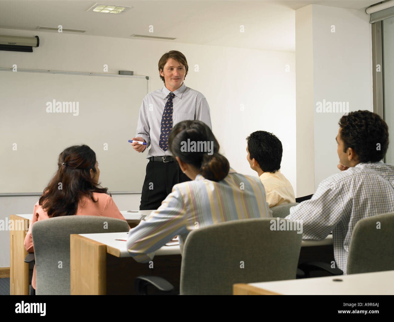 Young professionals in a training class Stock Photo - Alamy