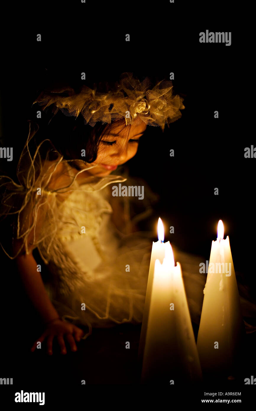 Head and shoulders portrait of a young girl by candlelight Stock Photo ...
