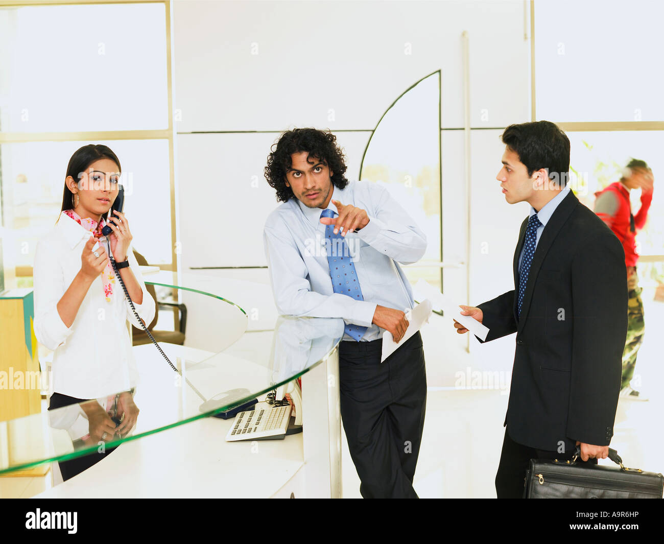 A formally dressed man asking for direction at a reception Stock Photo ...