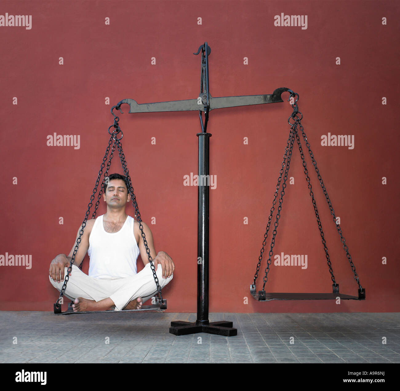 Portrait of a man sitting on a balance and meditating Studio shot Stock ...