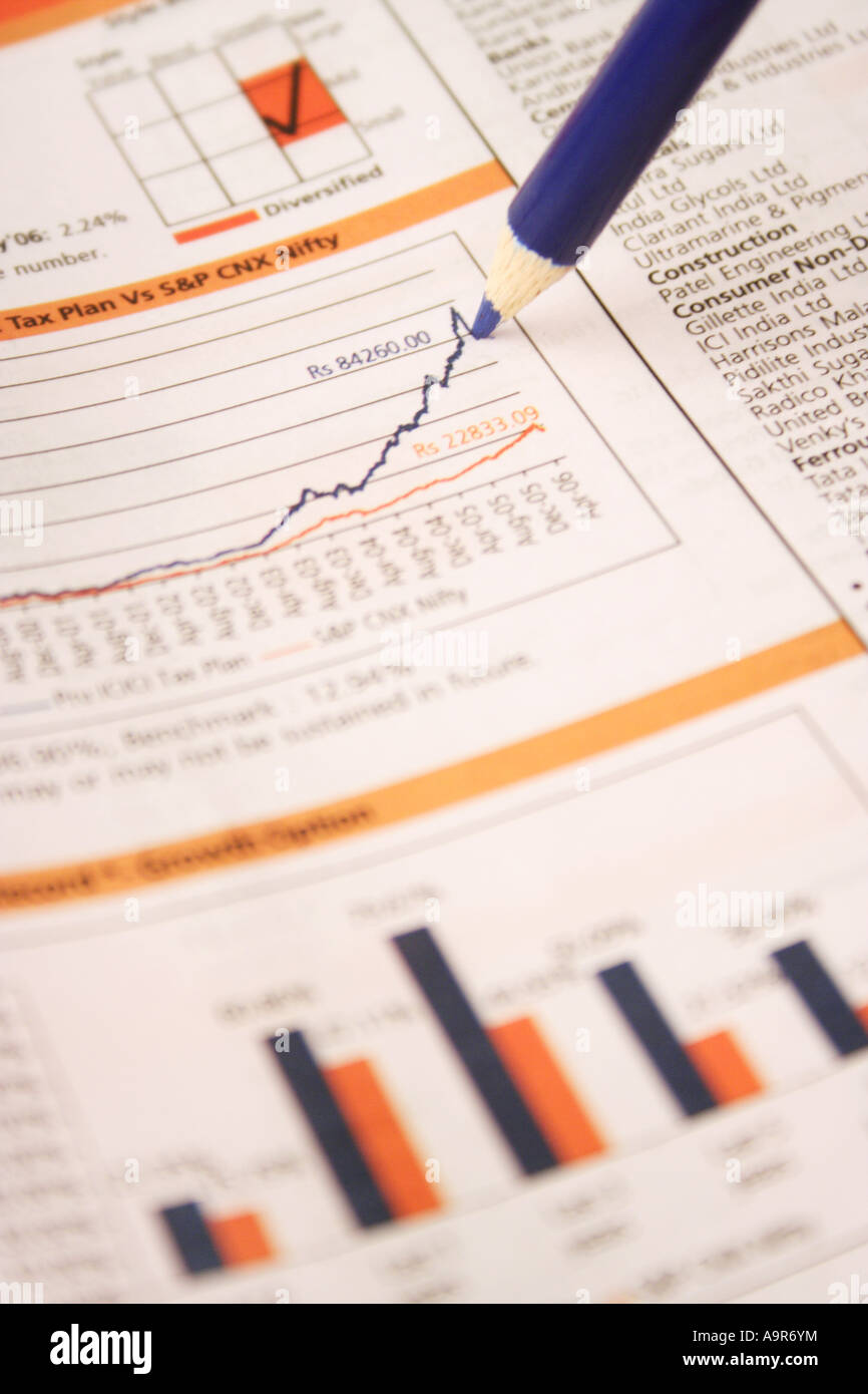A colour pencil marking a financial chart Stock Photo - Alamy