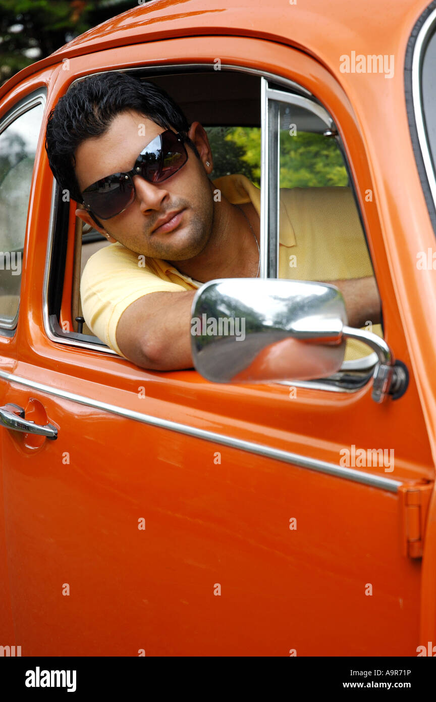 Man looking out of his car window Stock Photo - Alamy