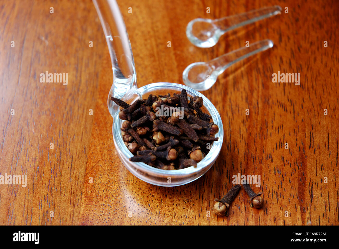 Clove in a spoon Stock Photo - Alamy