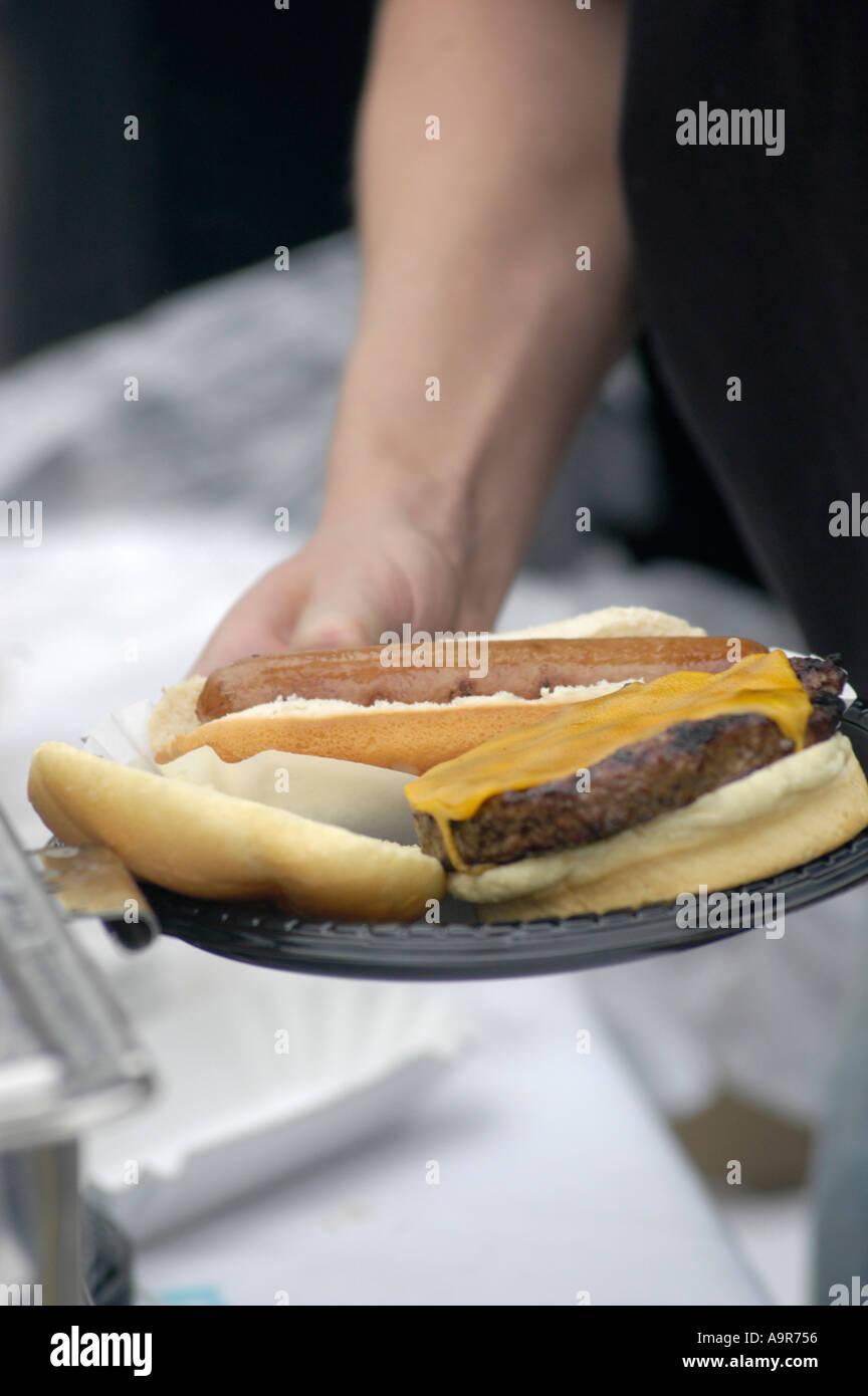 Hamburgers and Hotdogs cooking on Bar B Q at Club cookout for kids and ...
