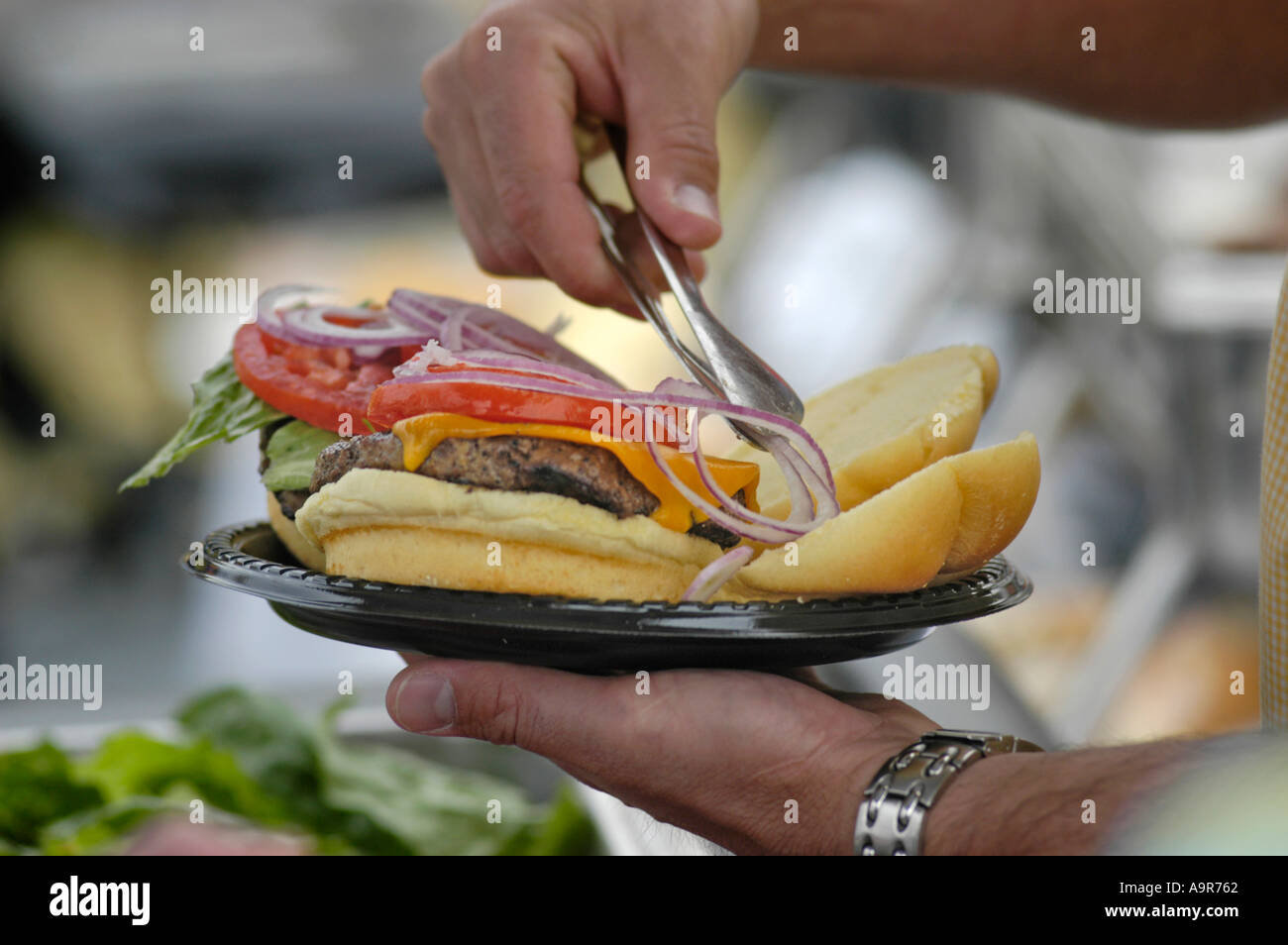 Hamburgers and Hotdogs cooking on Bar B Q at Club cookout for kids and ...