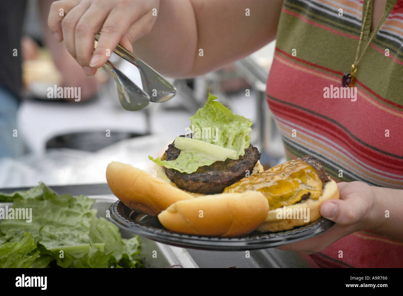 Hamburgers and Hotdogs cooking on Bar B Q at Club cookout for kids and ...