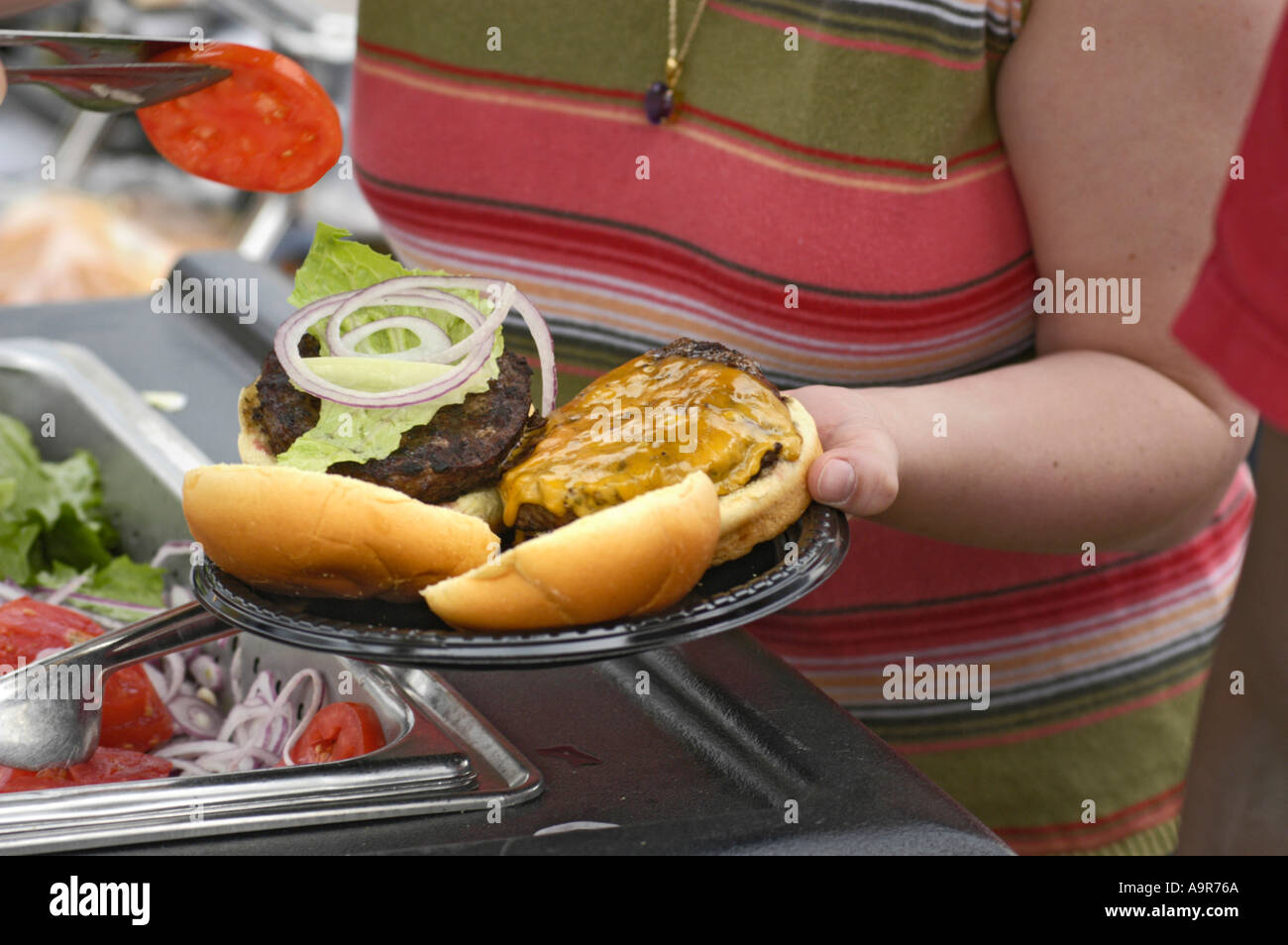 Hamburgers and Hotdogs cooking on Bar B Q at Club cookout for kids and ...
