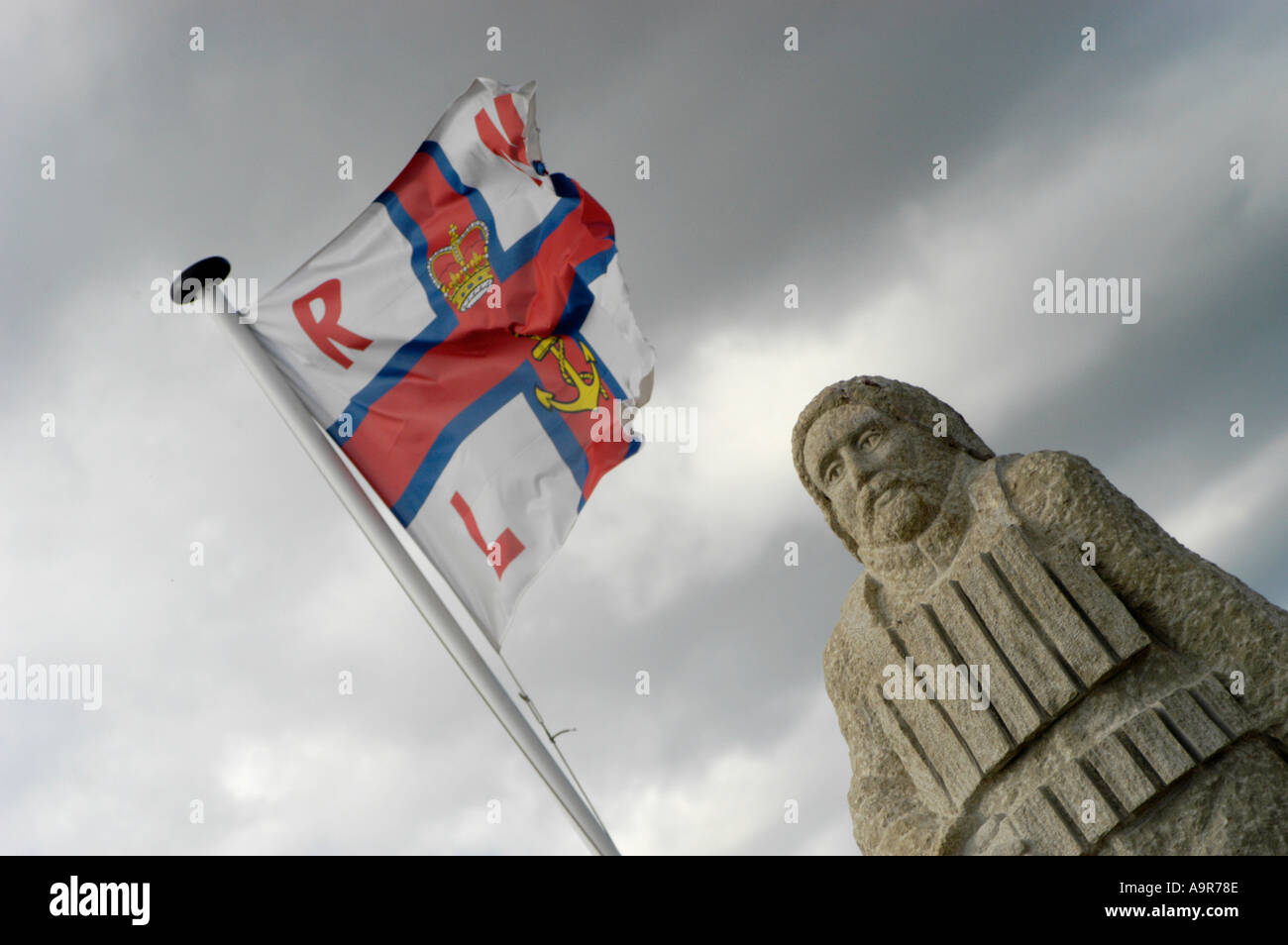 RNLI flag over liveboat man statue at the National Memorial Arboretum ...