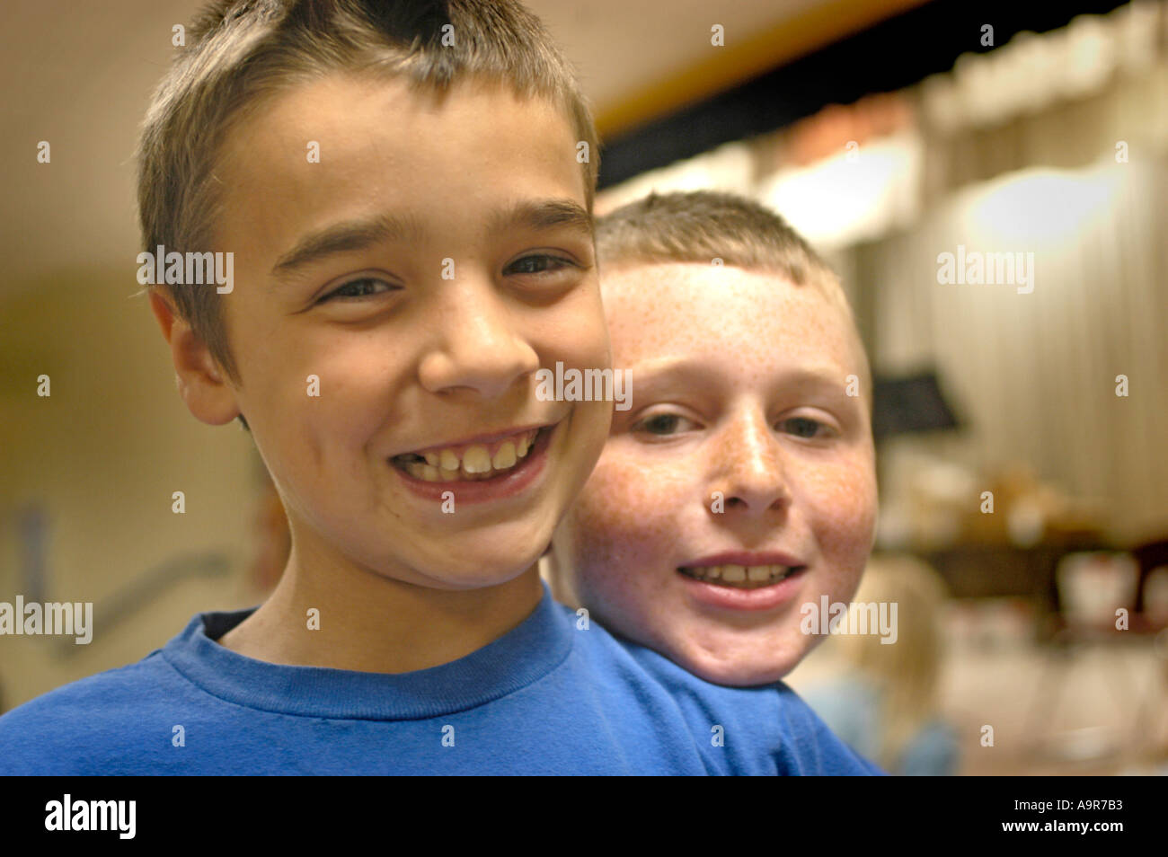 Friends playing as boys do for the camera Stock Photo - Alamy