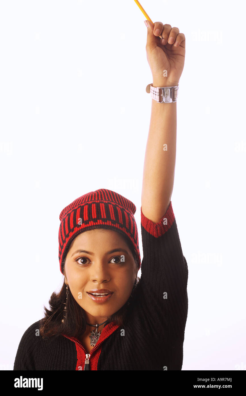 Young woman raising her hand up portrait Stock Photo - Alamy