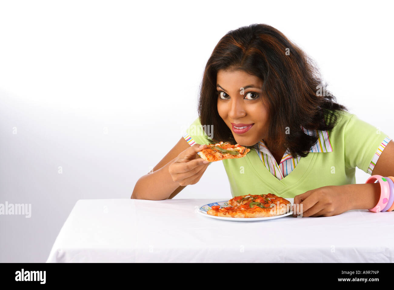 Studio shot woman eating Cut Out Stock Images & Pictures - Alamy