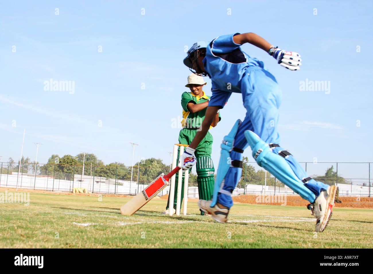 Batsman completing a run Stock Photo - Alamy
